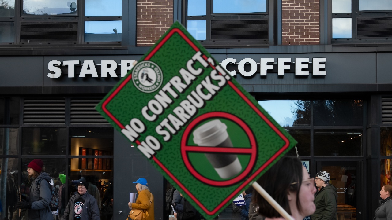 Verity - US: Over 1K Starbucks Baristas Strike on Red Cup Day in 40+ Cities